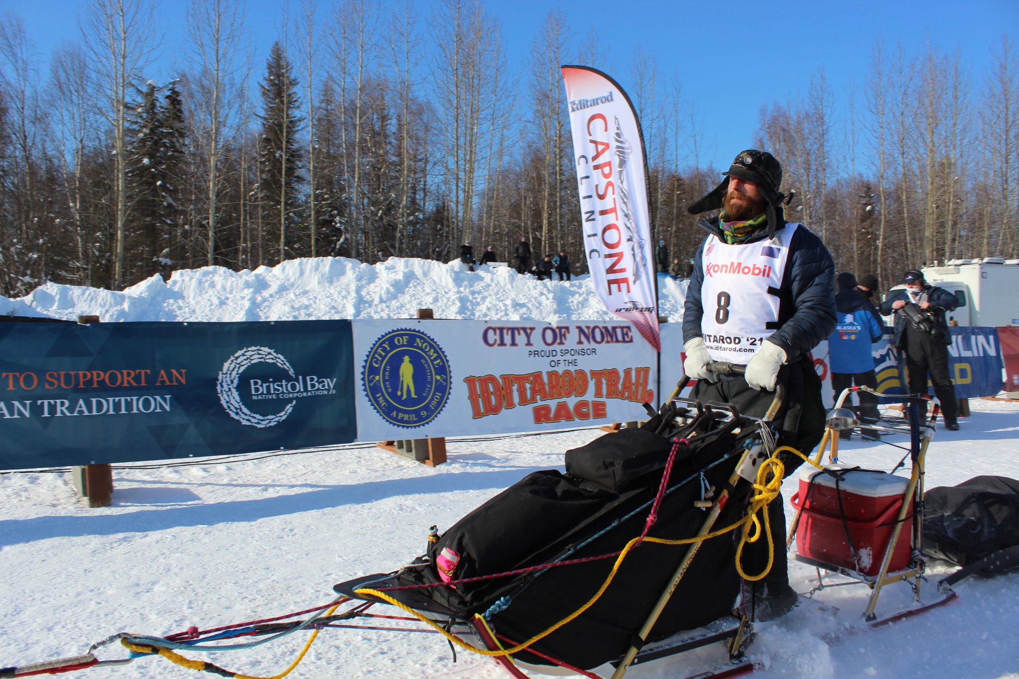 Veteran Iditarod musher Dennis Kananowicz scratches at McGrath (S ...