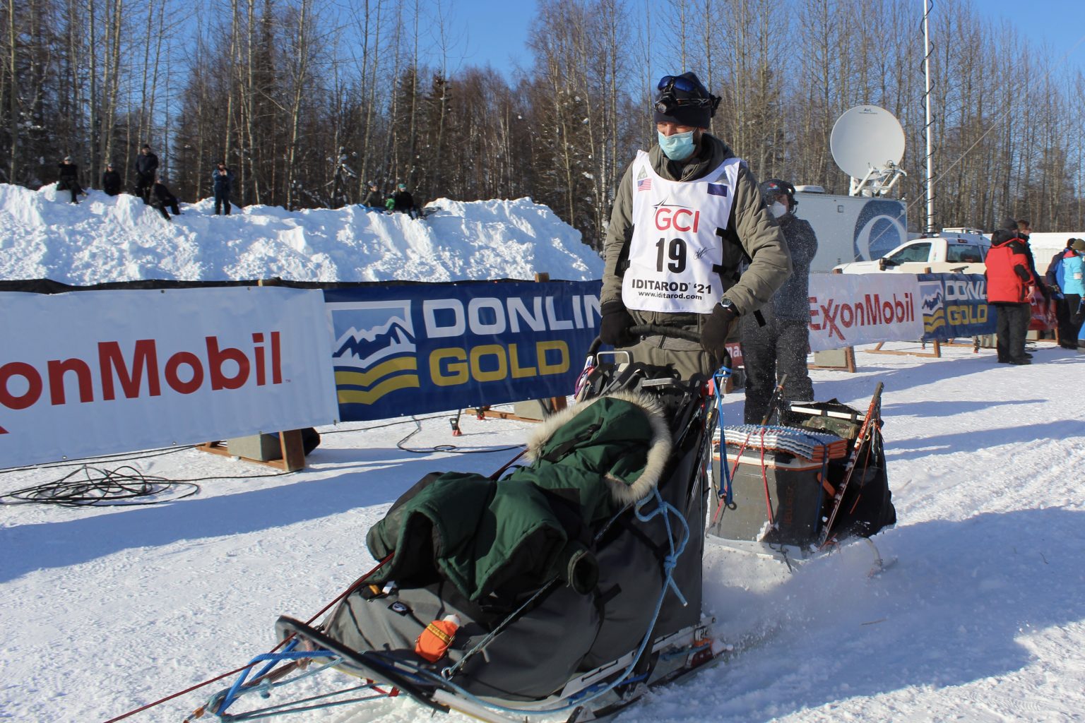 Rookie Iditarod musher Christopher Parker scratches at McGrath ...